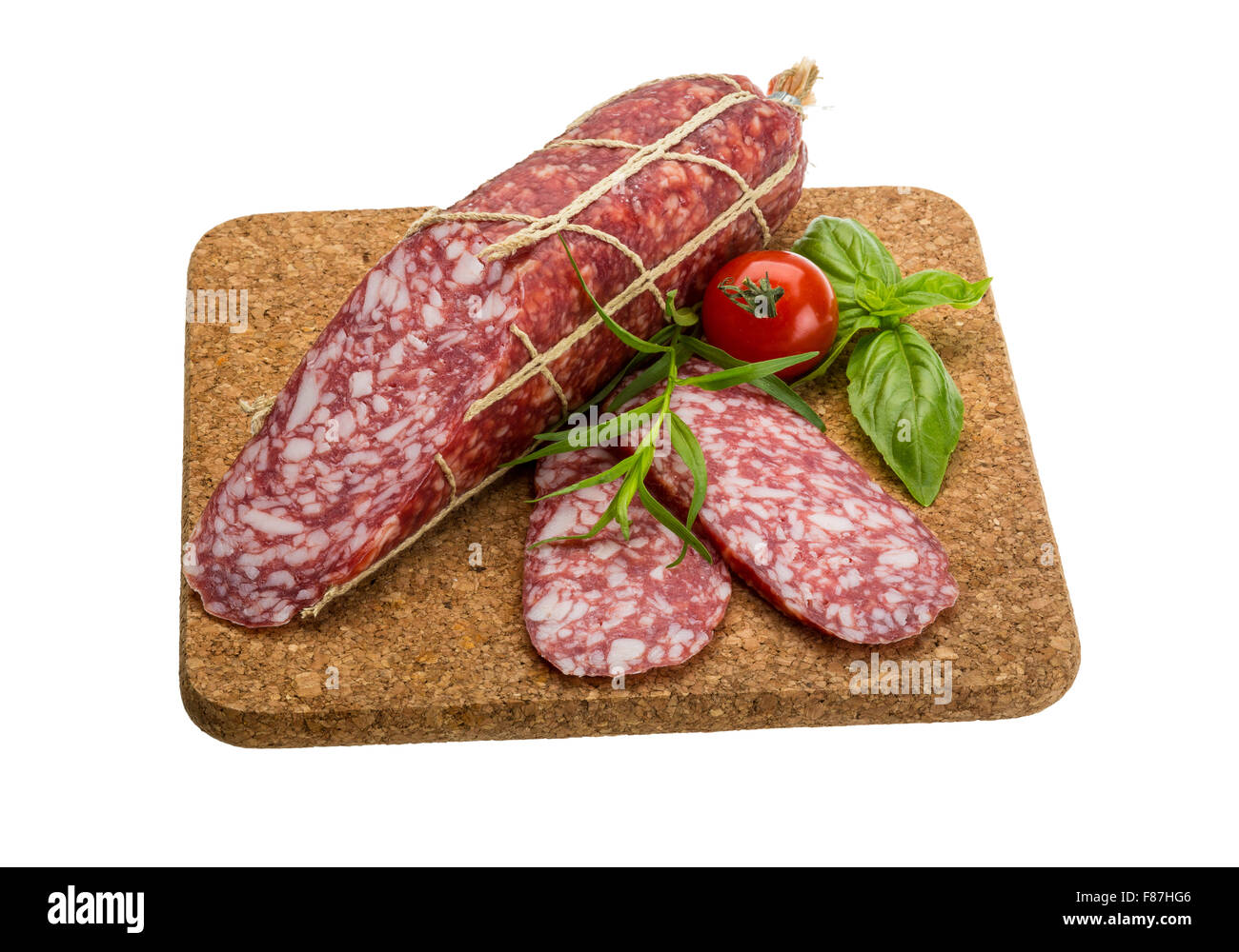 Salami sausages sliced with basil Stock Photo - Alamy