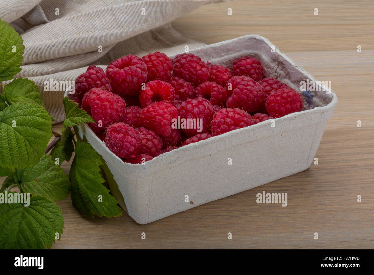 Fresh raspberry with leaf in the bowl Stock Photo - Alamy