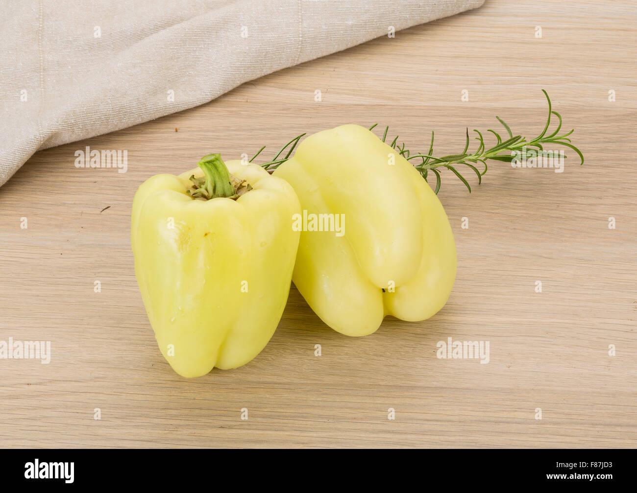Two semi green pepper - on the desk Stock Photo - Alamy