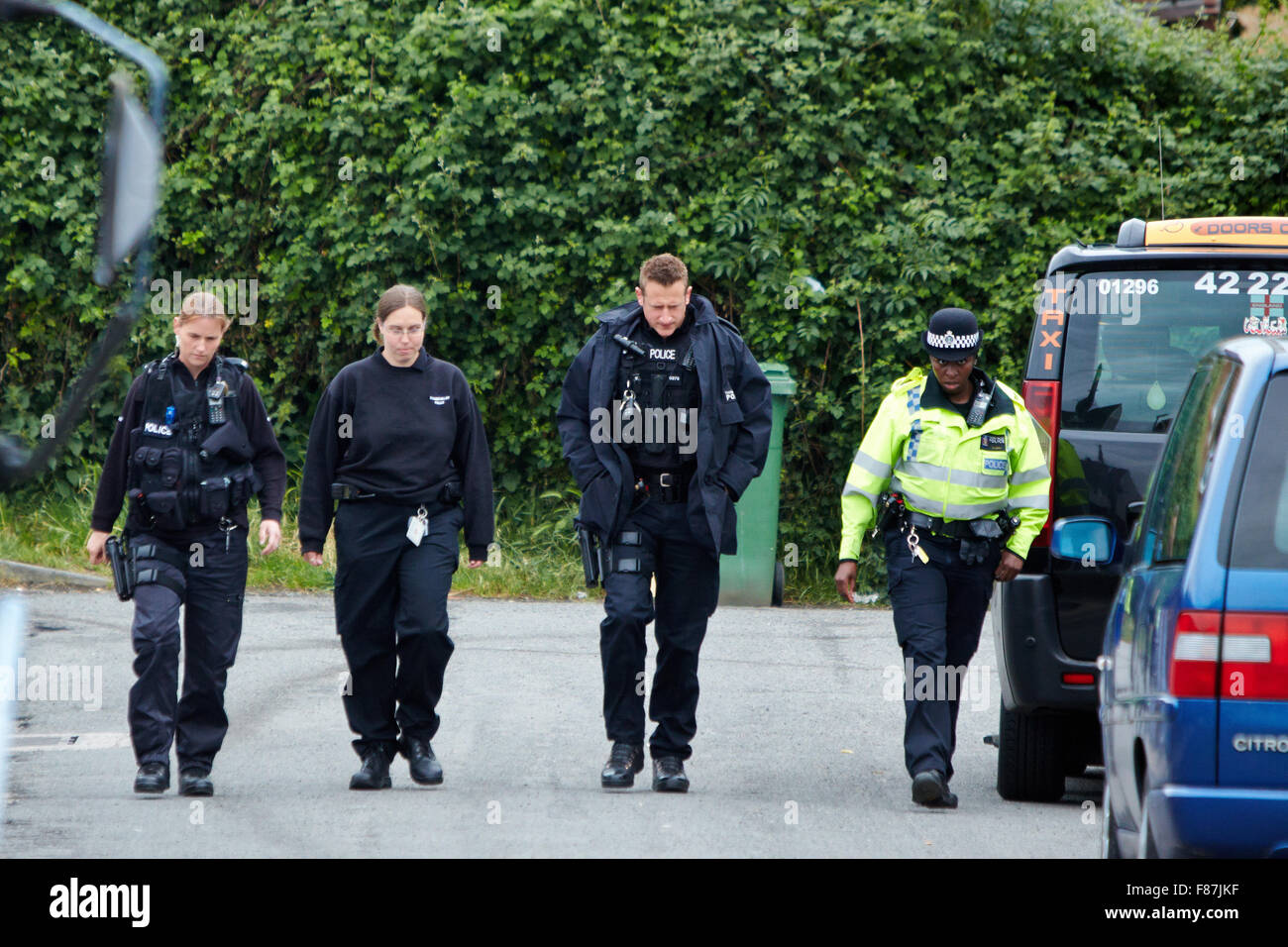 Police officers at the scene of the murder of Darrell Farnham, who was ...