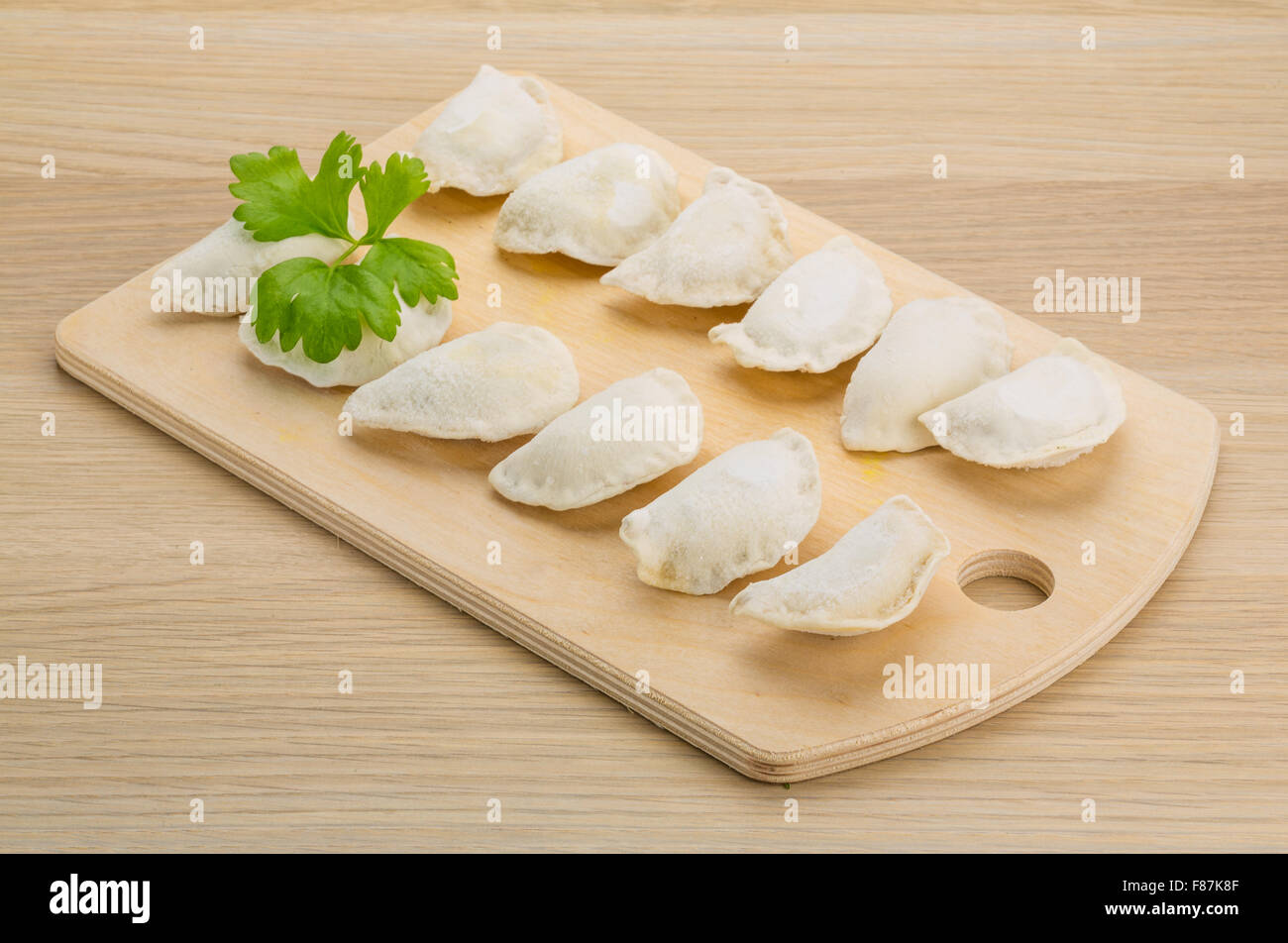 Raw Ukrainian vareniki on the board Stock Photo - Alamy
