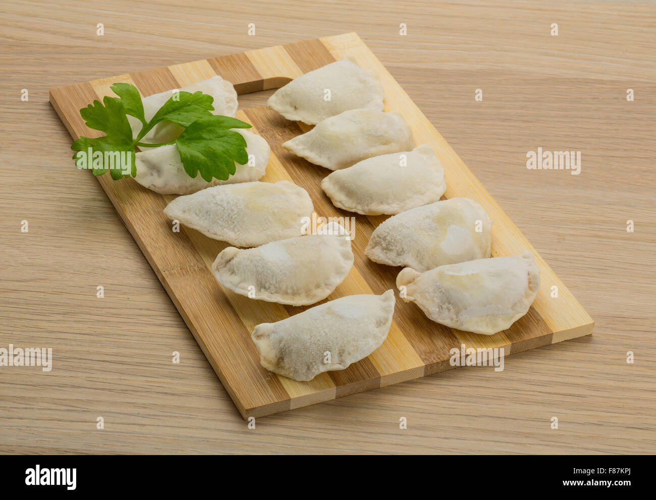 Raw Ukrainian vareniki on the board Stock Photo - Alamy