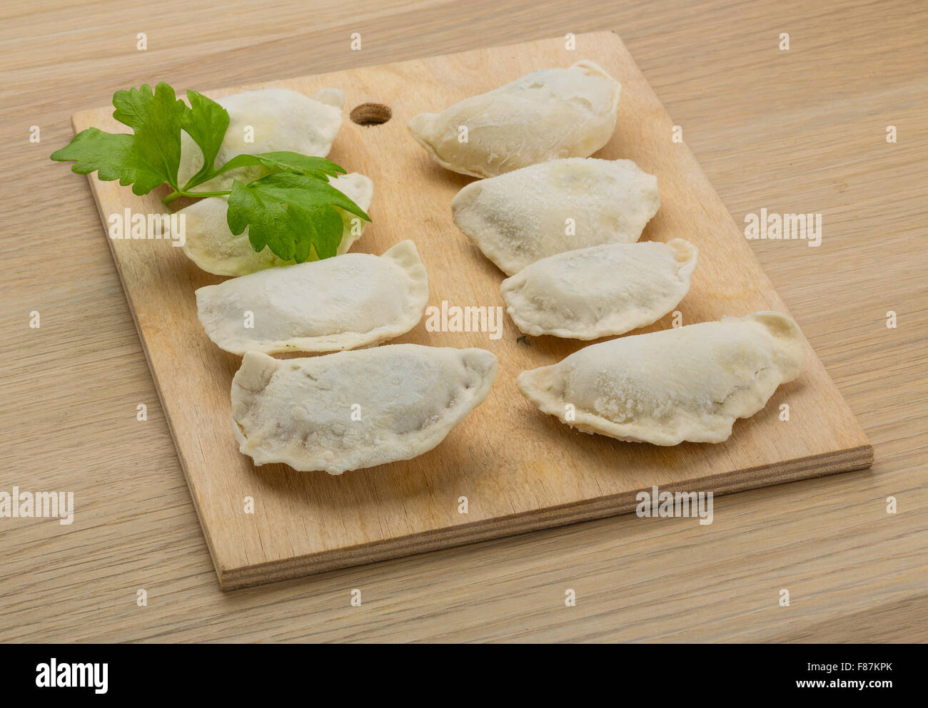 Raw Ukrainian vareniki on the board Stock Photo - Alamy