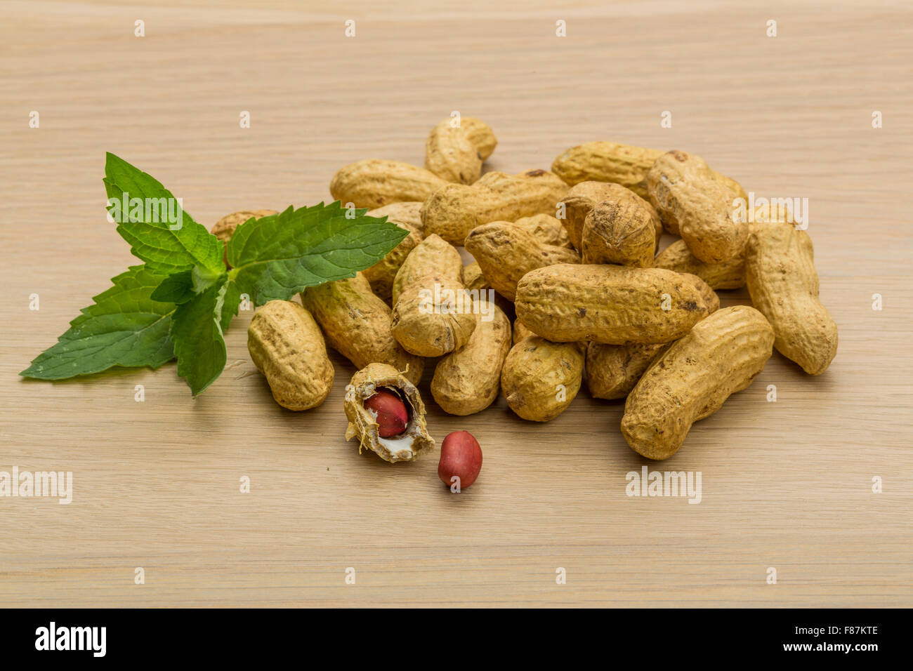Peanut heap on the desk Stock Photo - Alamy