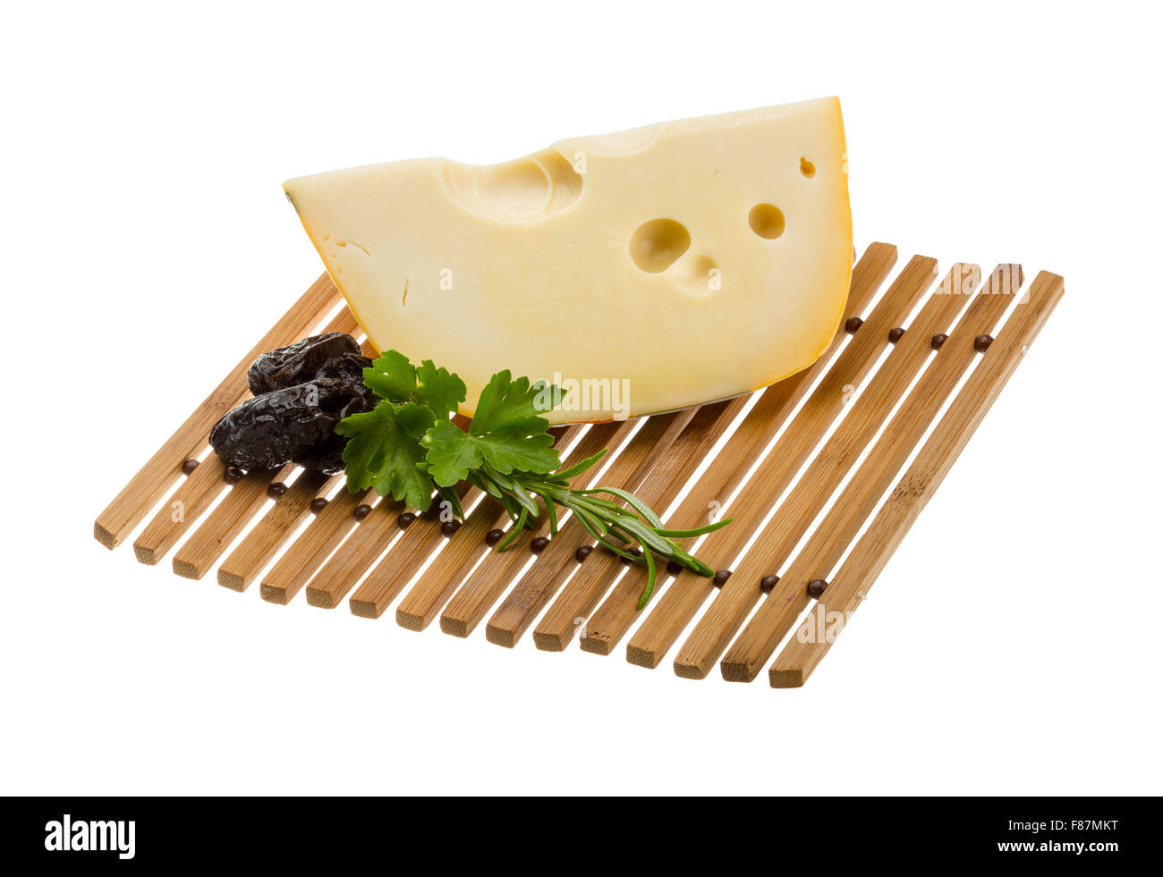 Maasdam cheese with thyme and tomato Stock Photo - Alamy
