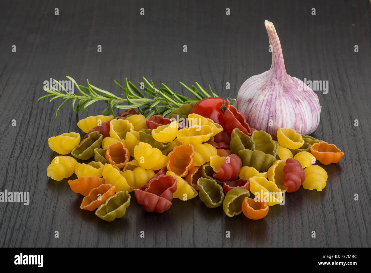 Raw shell pasta with herbs Stock Photo - Alamy