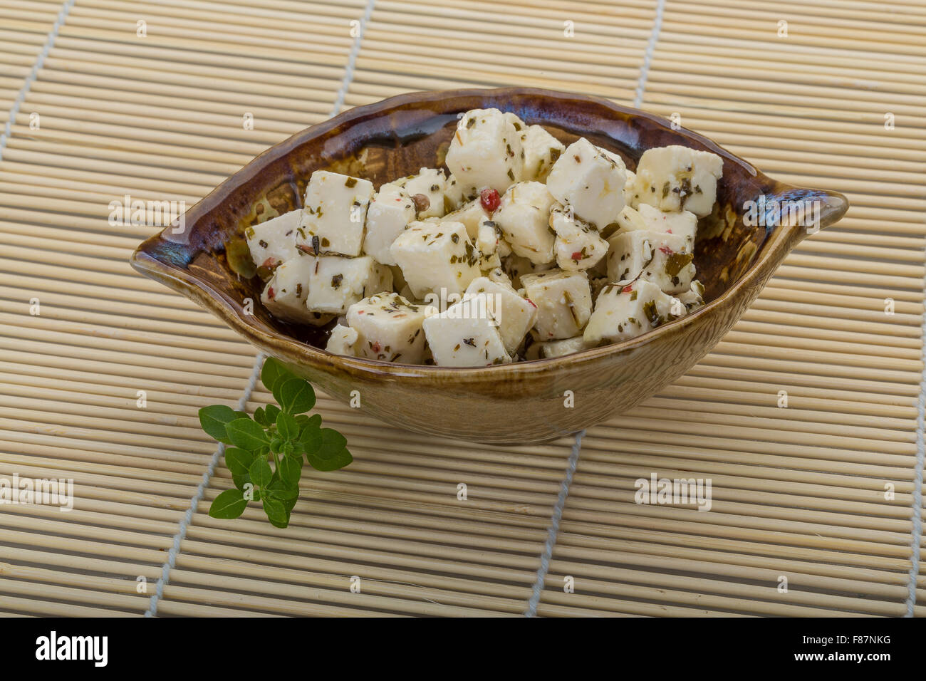 Soft cheese with spices and olive oil Stock Photo - Alamy