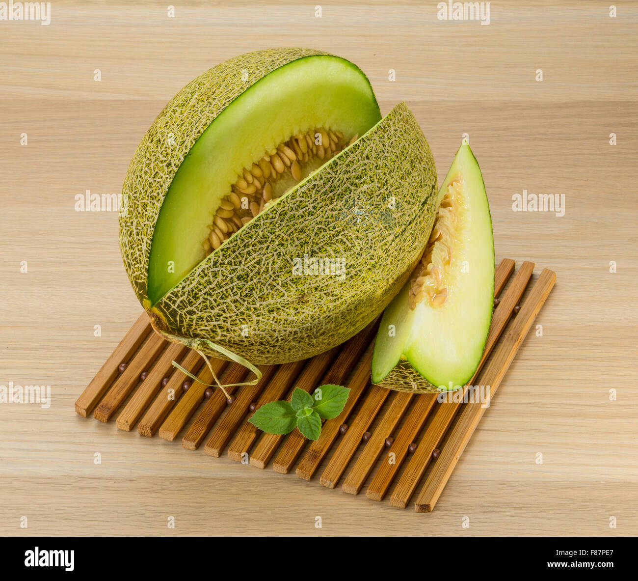 Fresh ripe melon sliced on the desk Stock Photo - Alamy