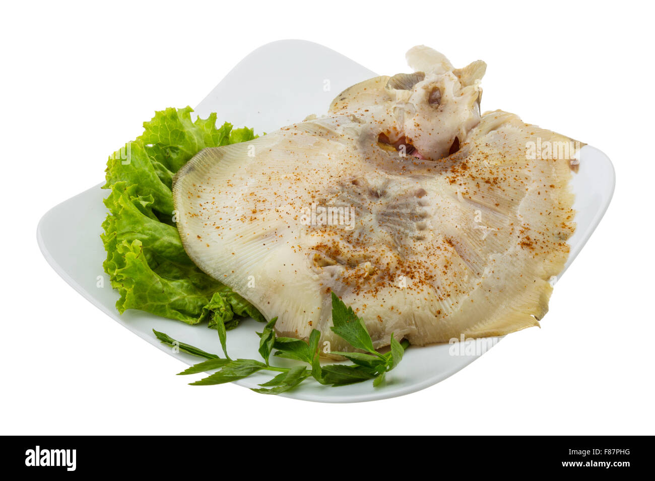 Grilled ray fish - Batoidea with salad Stock Photo - Alamy