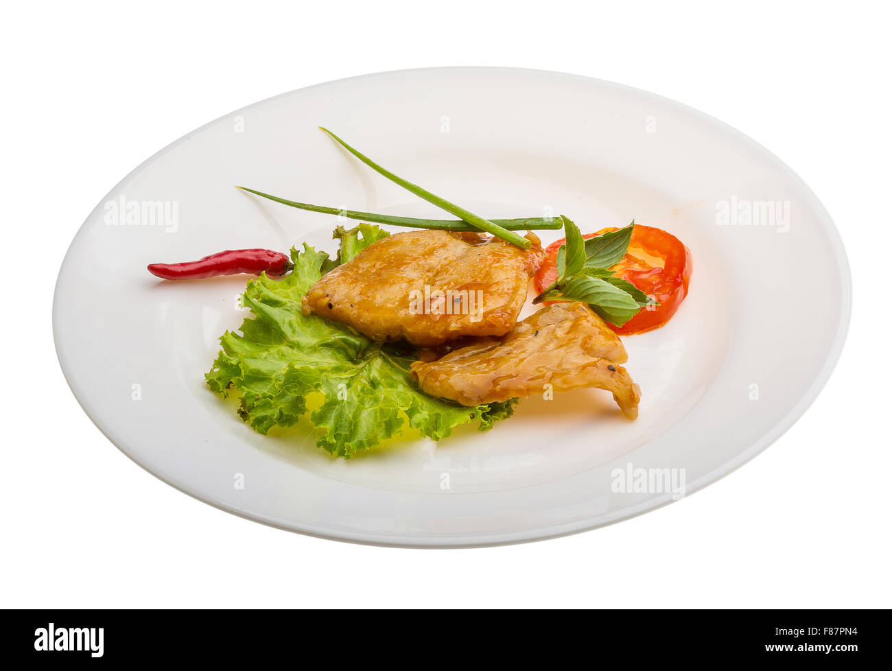 Baracuda steak with sauce and salad Stock Photo - Alamy