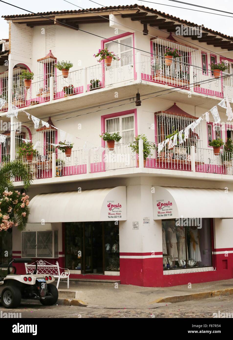 A white and pink building in Puerto Vallarta Mexico Stock Photo - Alamy