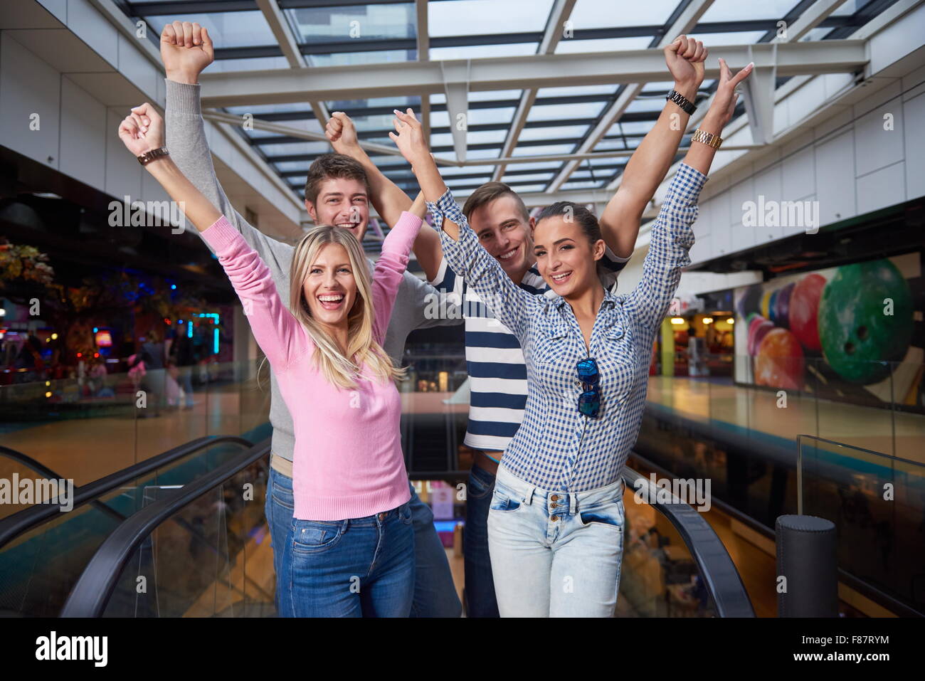 group of happy friends in shopping mall have fun Stock Photo - Alamy