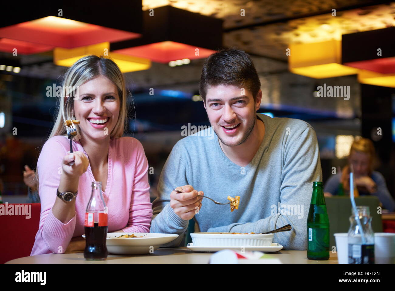 couple having lunch break in shopping mall food corner Stock Photo - Alamy