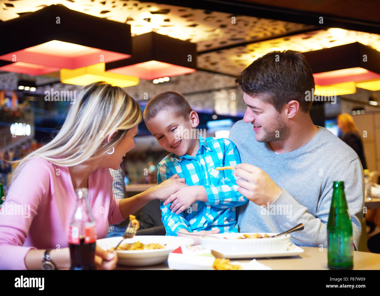 family together have break at lunch in shopping mall Stock Photo - Alamy