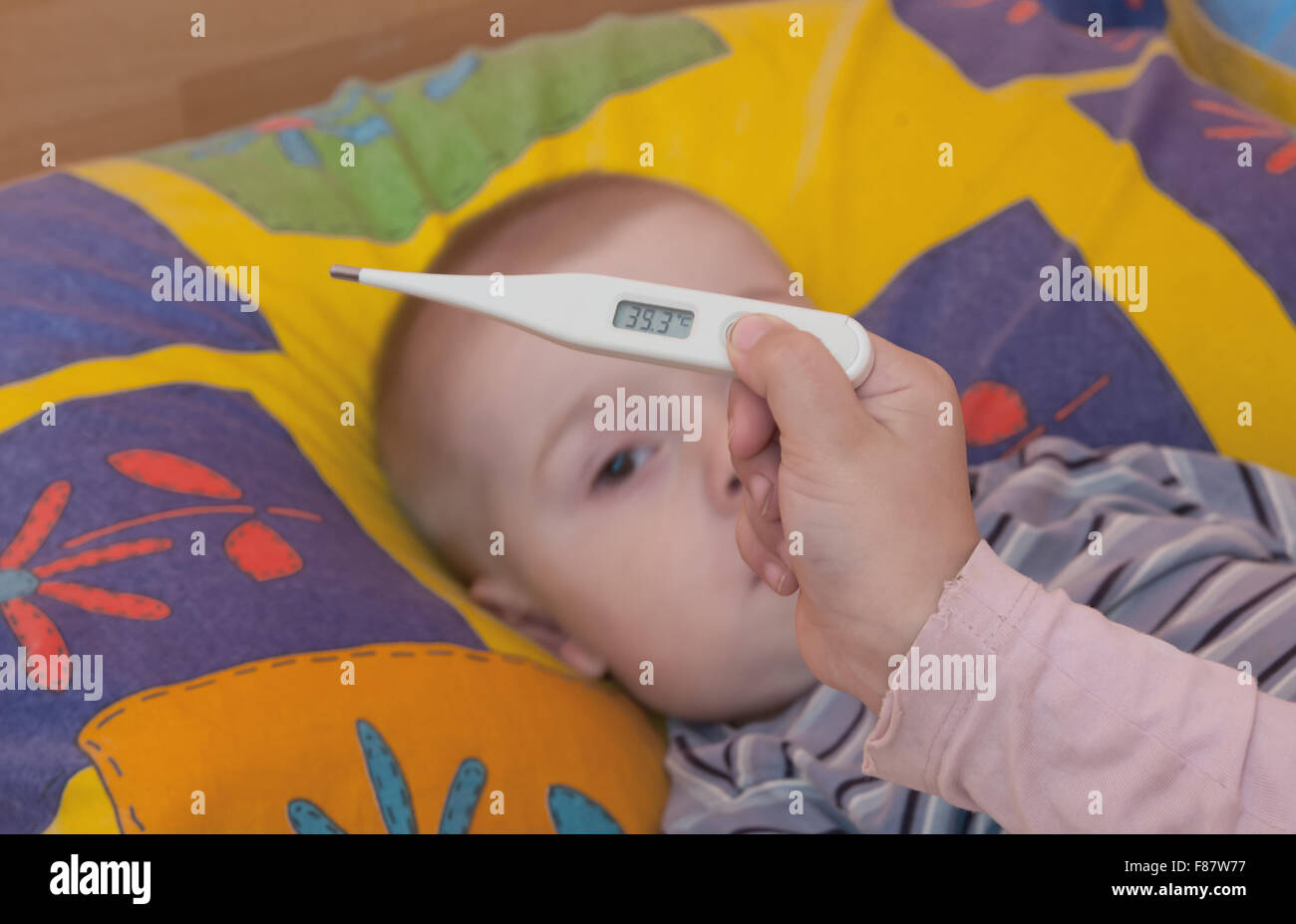 sick little boy in bed. Measuring of temperature Stock Photo - Alamy