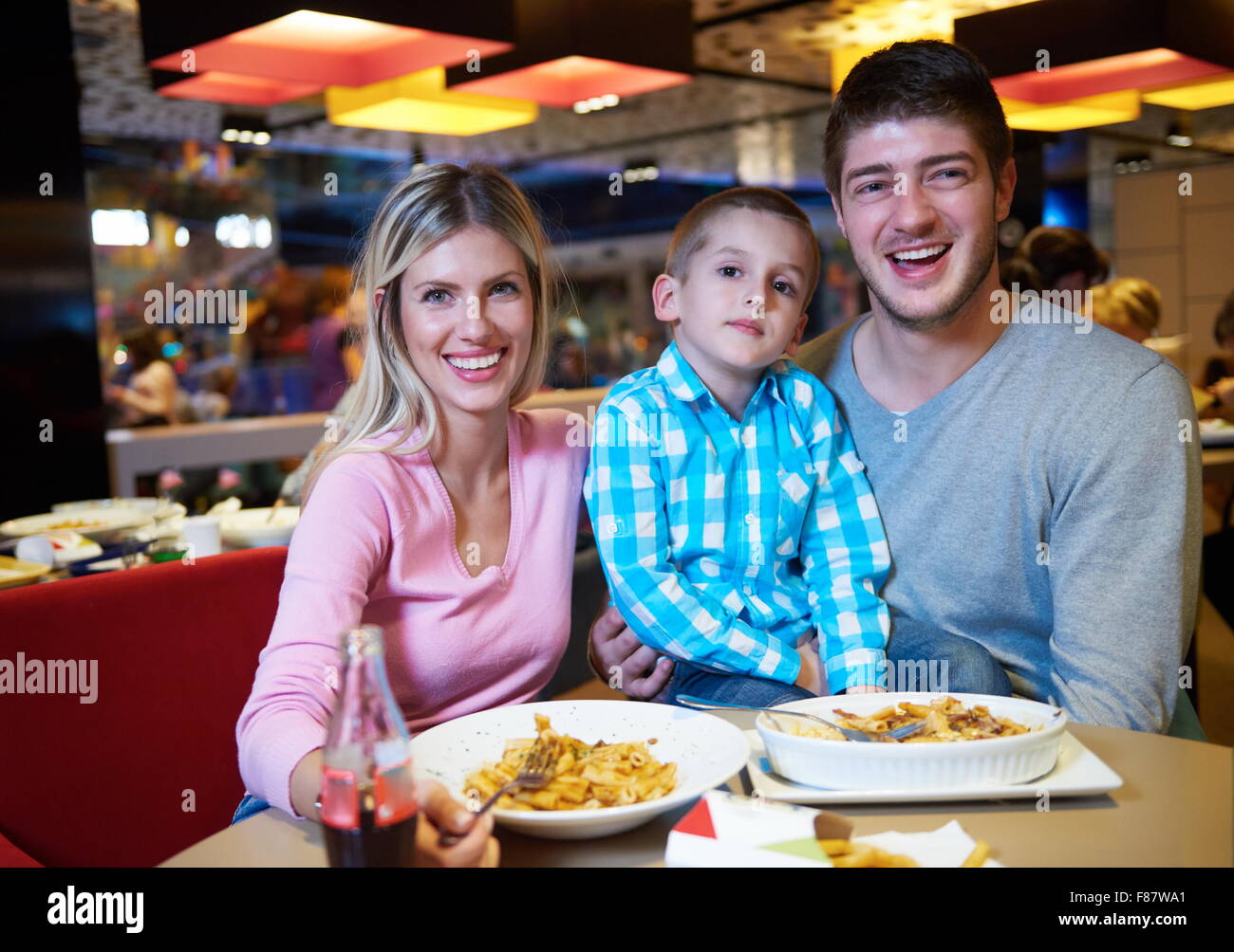 family together have break at lunch in shopping mall Stock Photo - Alamy