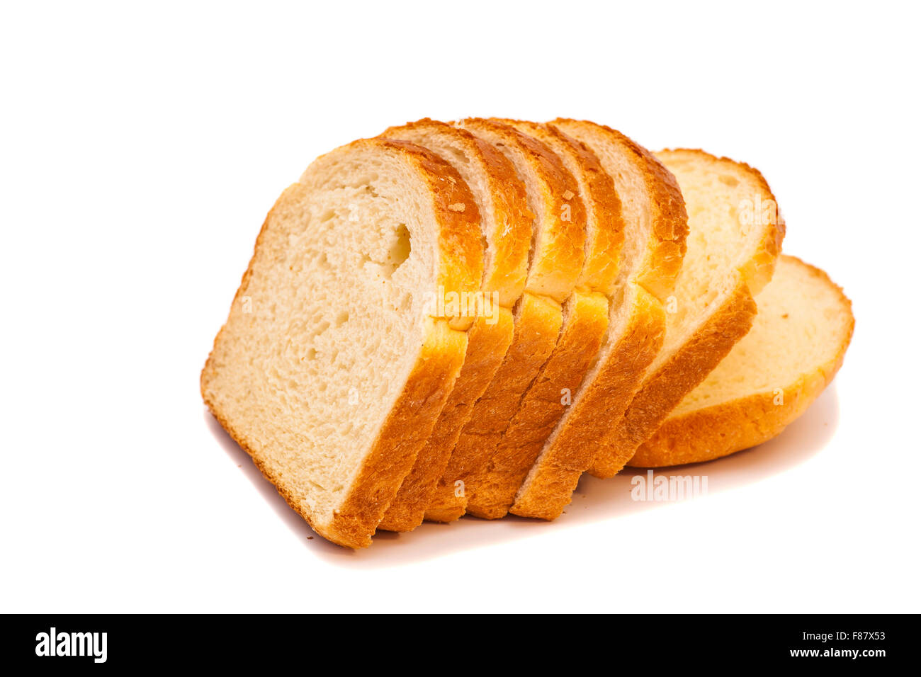 The cut loaf of bread isolated on white Stock Photo - Alamy