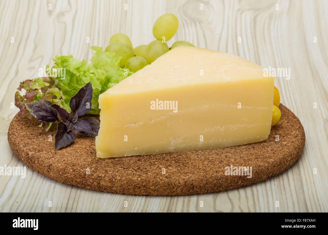 Part of parmesan cheese on the wood backgrounds Stock Photo - Alamy