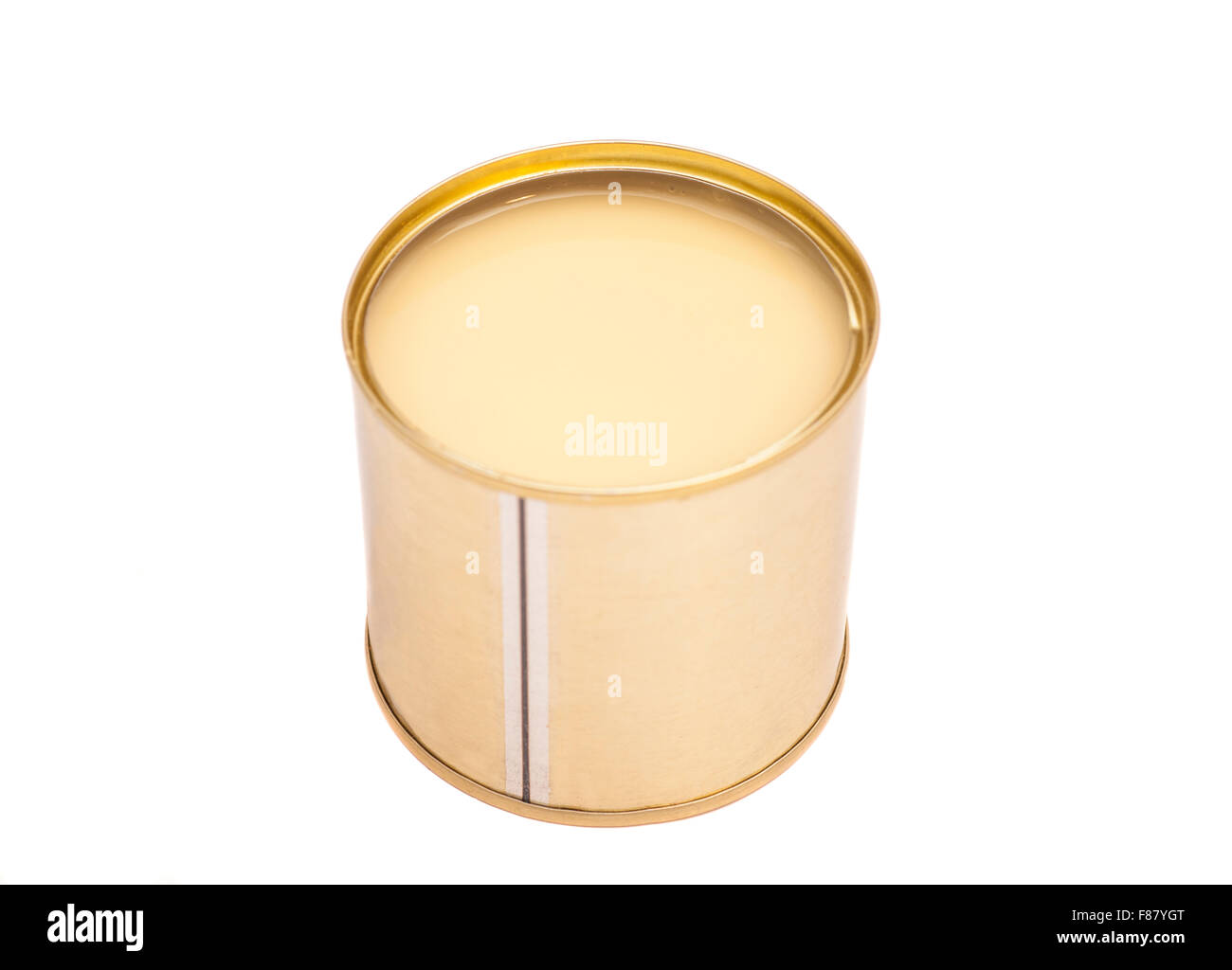 Condensed milk in tin can over white background Stock Photo - Alamy