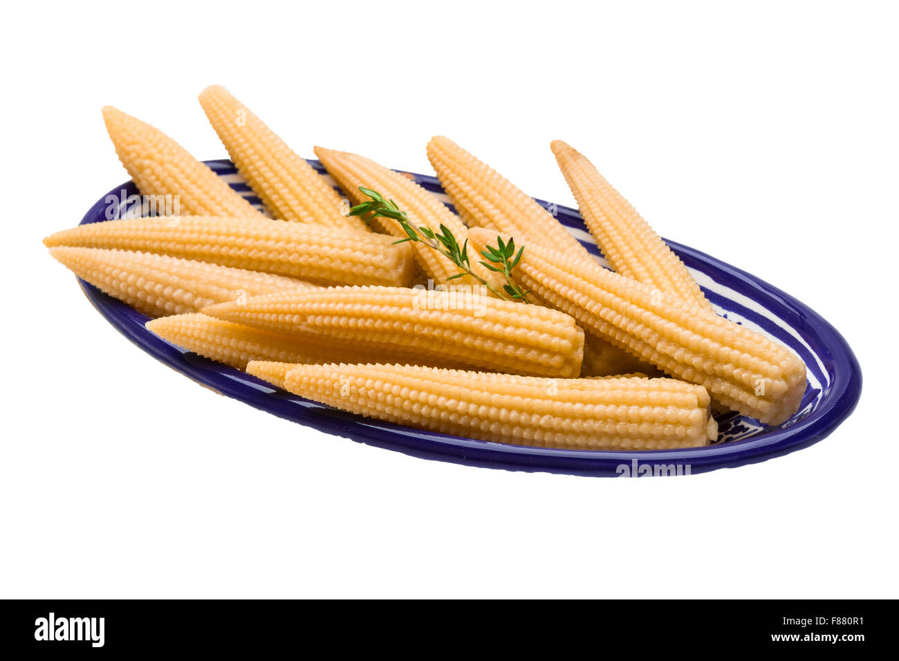 Baby corn with thyme Stock Photo - Alamy