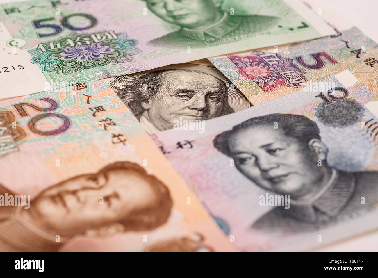 Hundred dollar bill surrounded by Chinese Yuan Stock Photo - Alamy