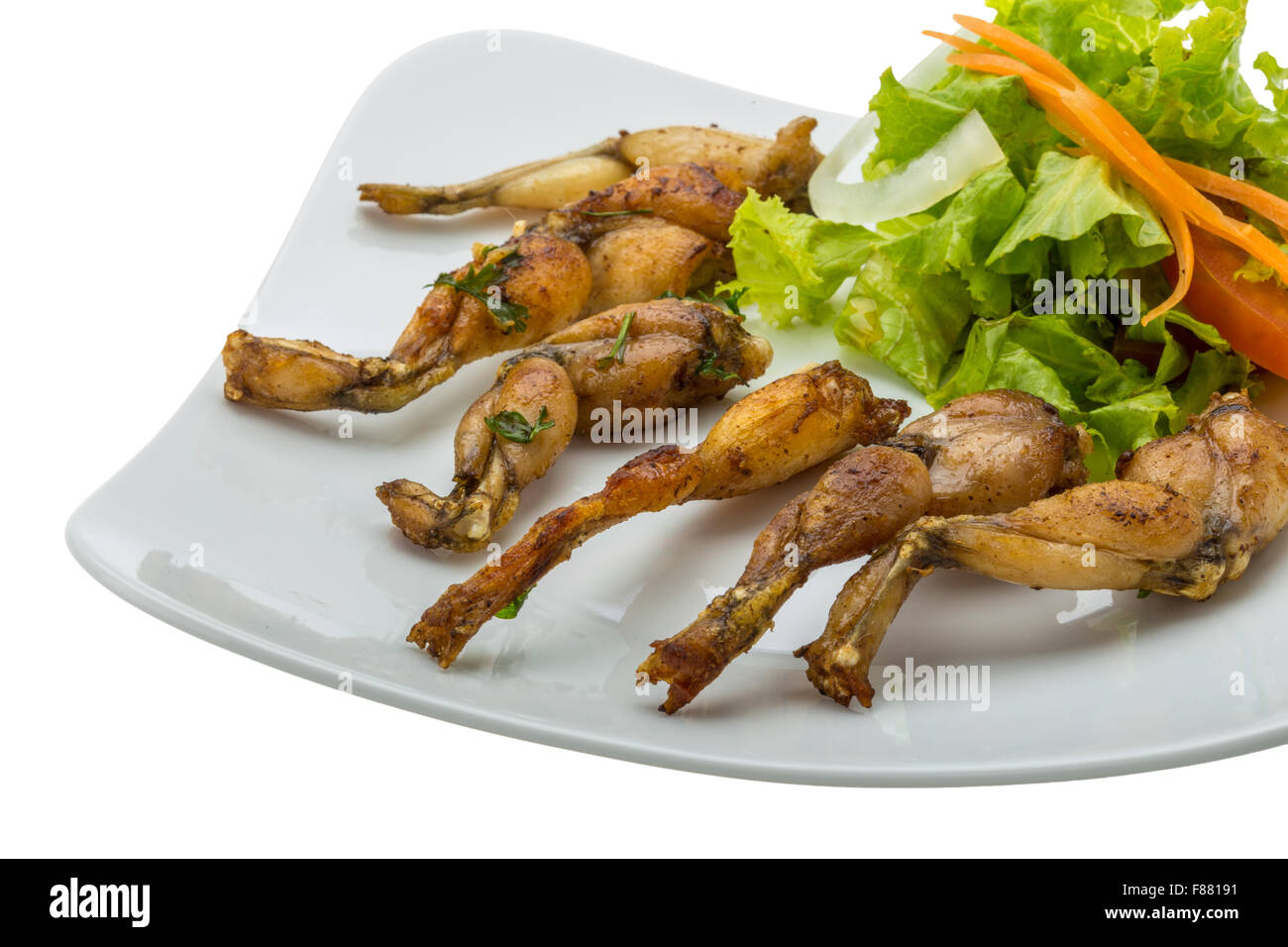 Grilled frog legs - French style Stock Photo - Alamy