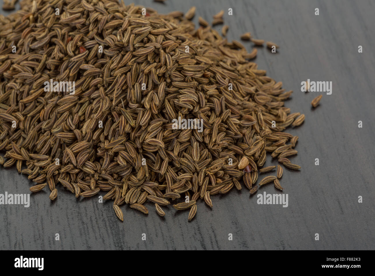 Caraway seeds on the desk Stock Photo - Alamy