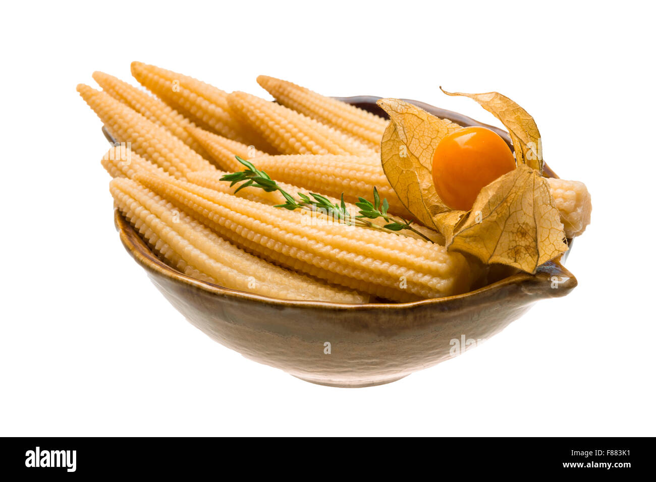 Baby corn with thyme Stock Photo - Alamy
