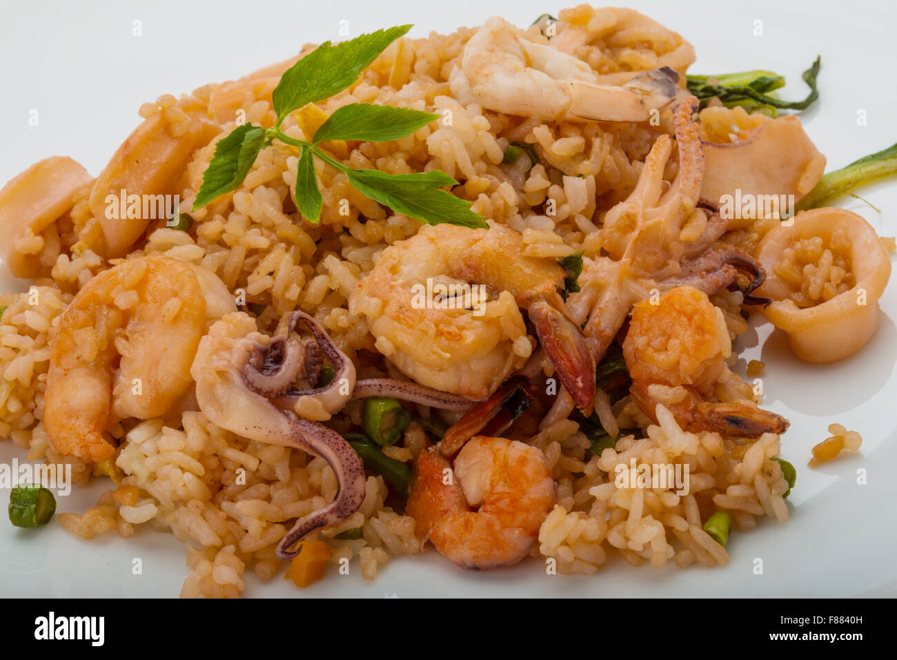Rice with seafood isolated on white Stock Photo - Alamy