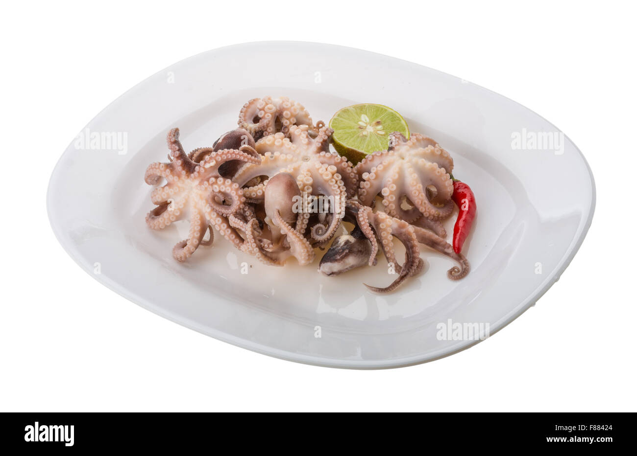 Boiled octopus with pepper and lime Stock Photo - Alamy