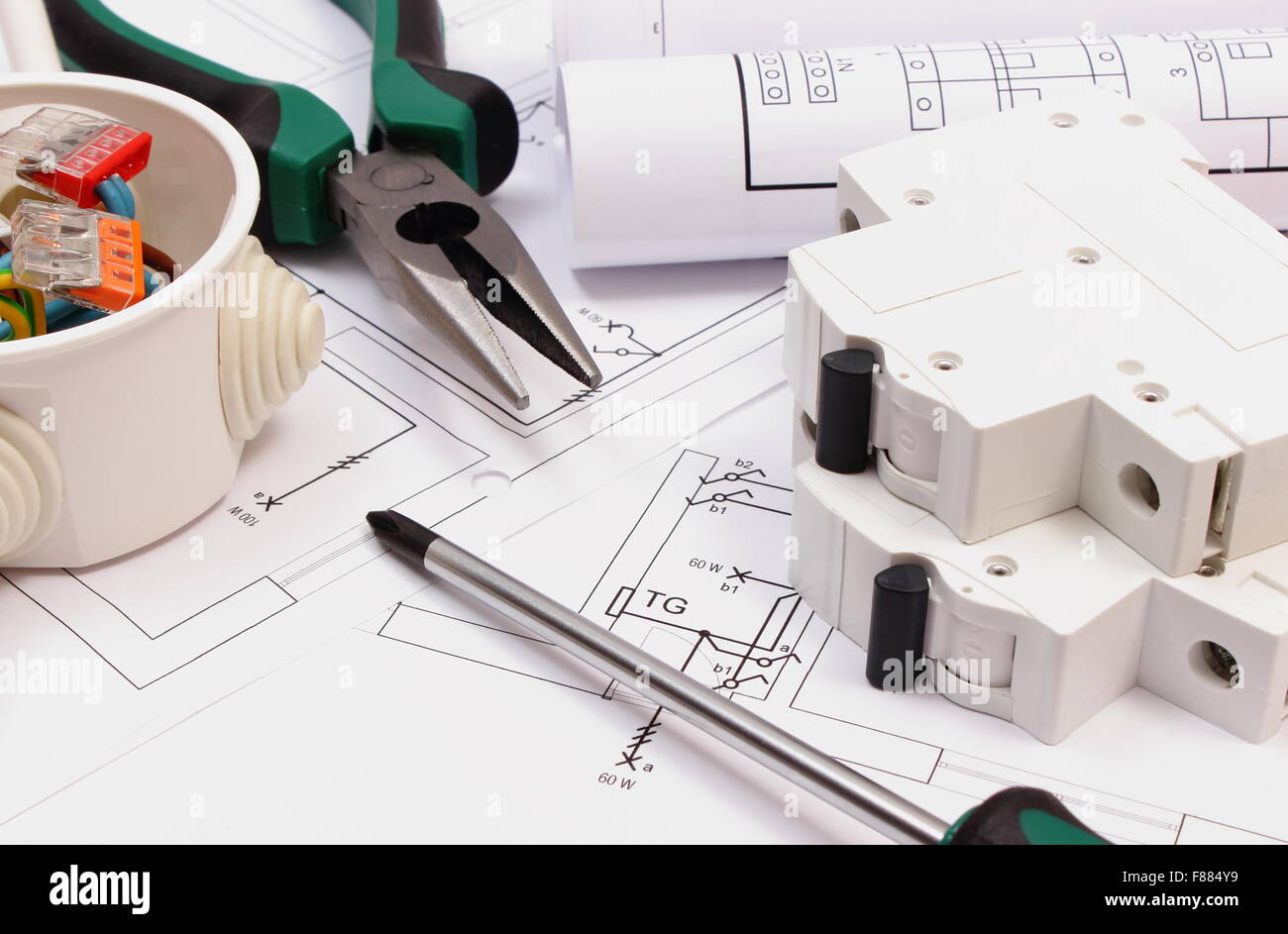 Work tools, cable in electrical box and electric fuse lying on ...