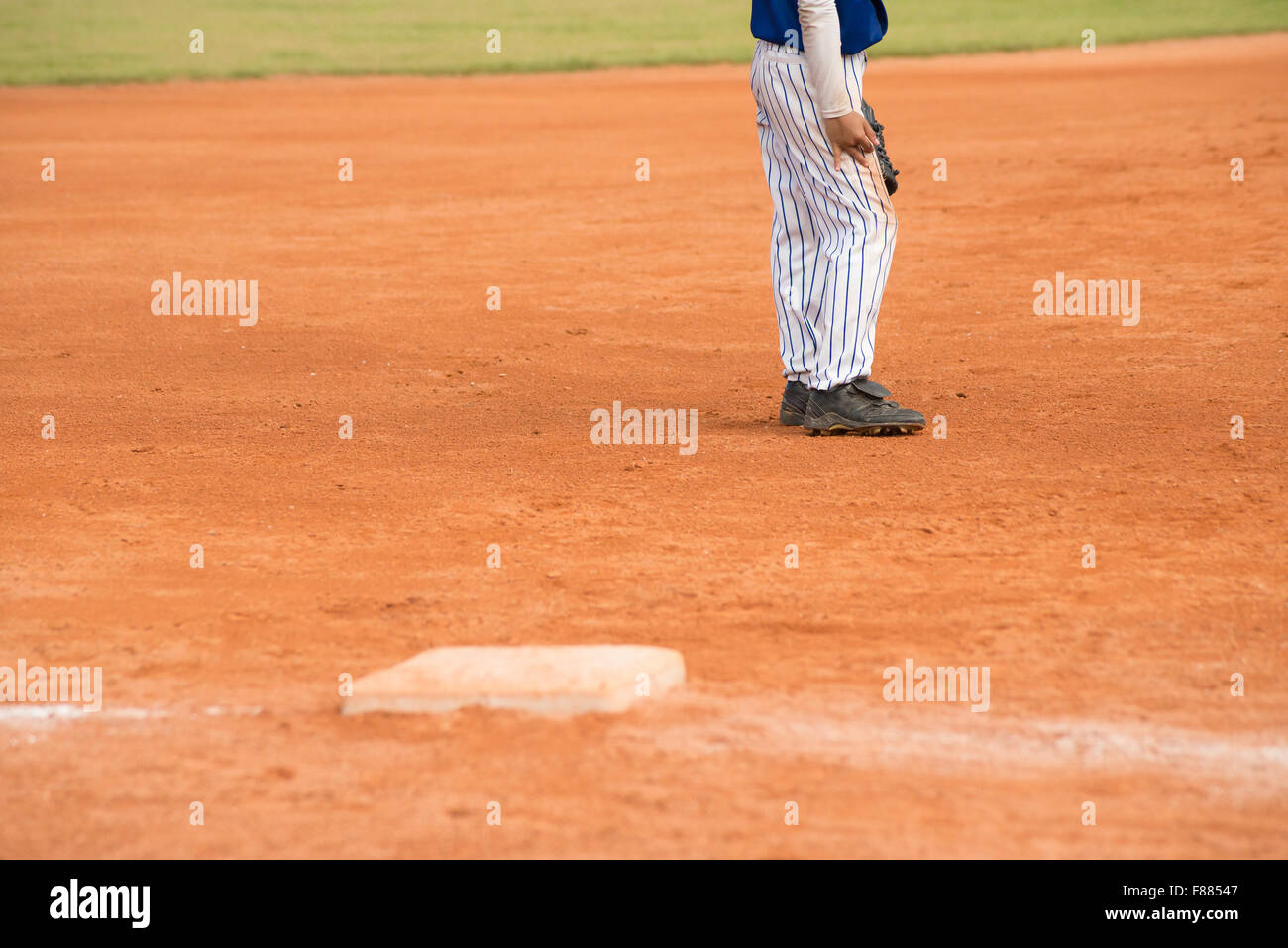 player standing on a baseball field Stock Photo - Alamy