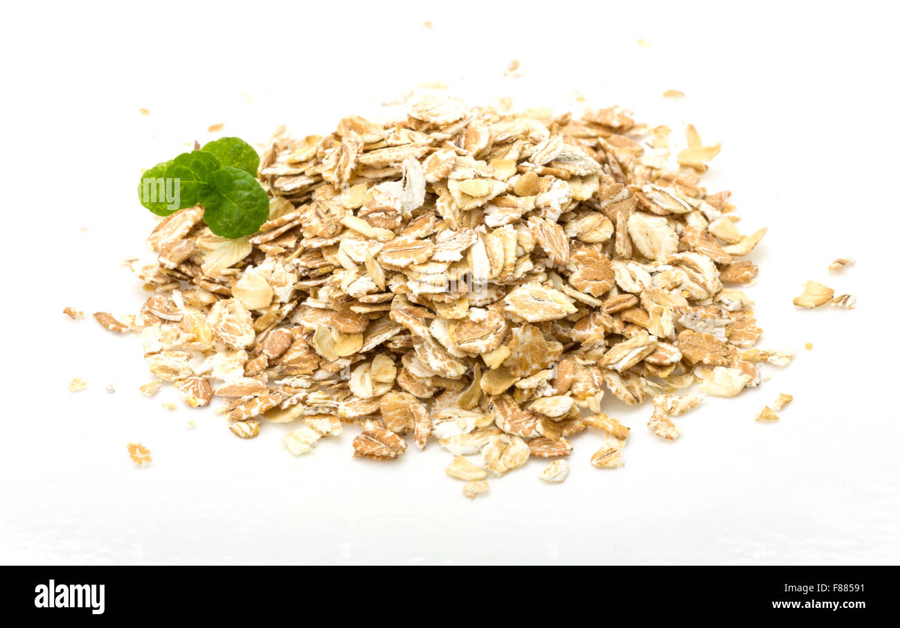 Oats heap isolated on white with mint Stock Photo - Alamy