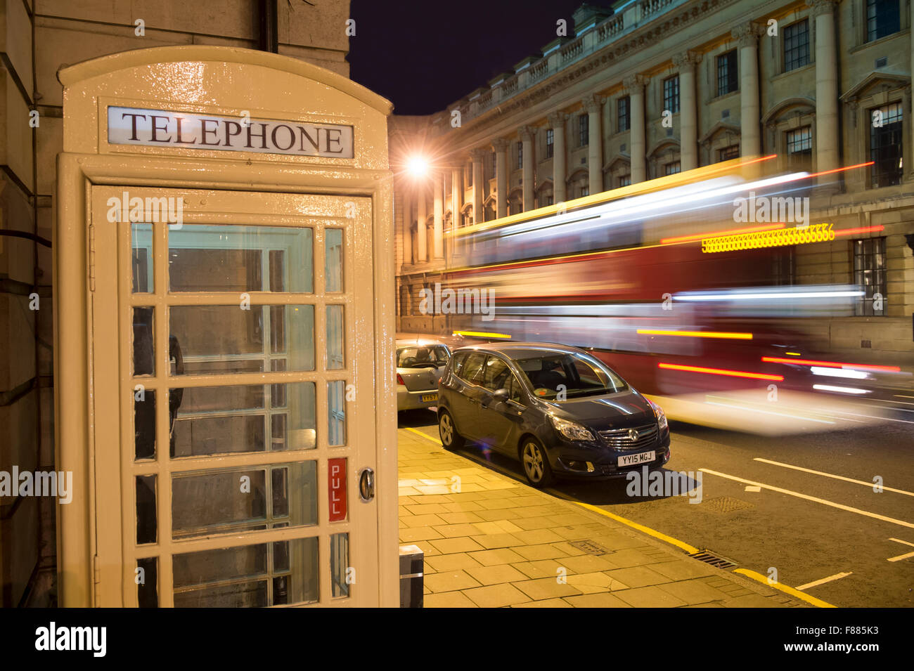 A cream KC Telephone box lit up at night in Hull, East Yorkshire Stock ...