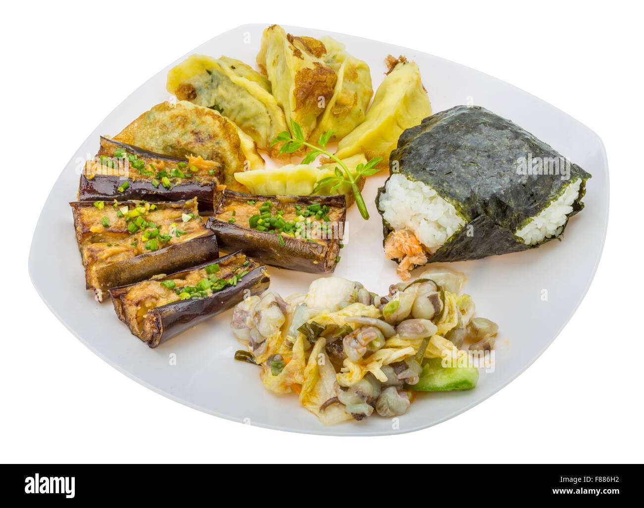 Japan traditional food - rice ball, gyoza, eggplant and octopus salad ...