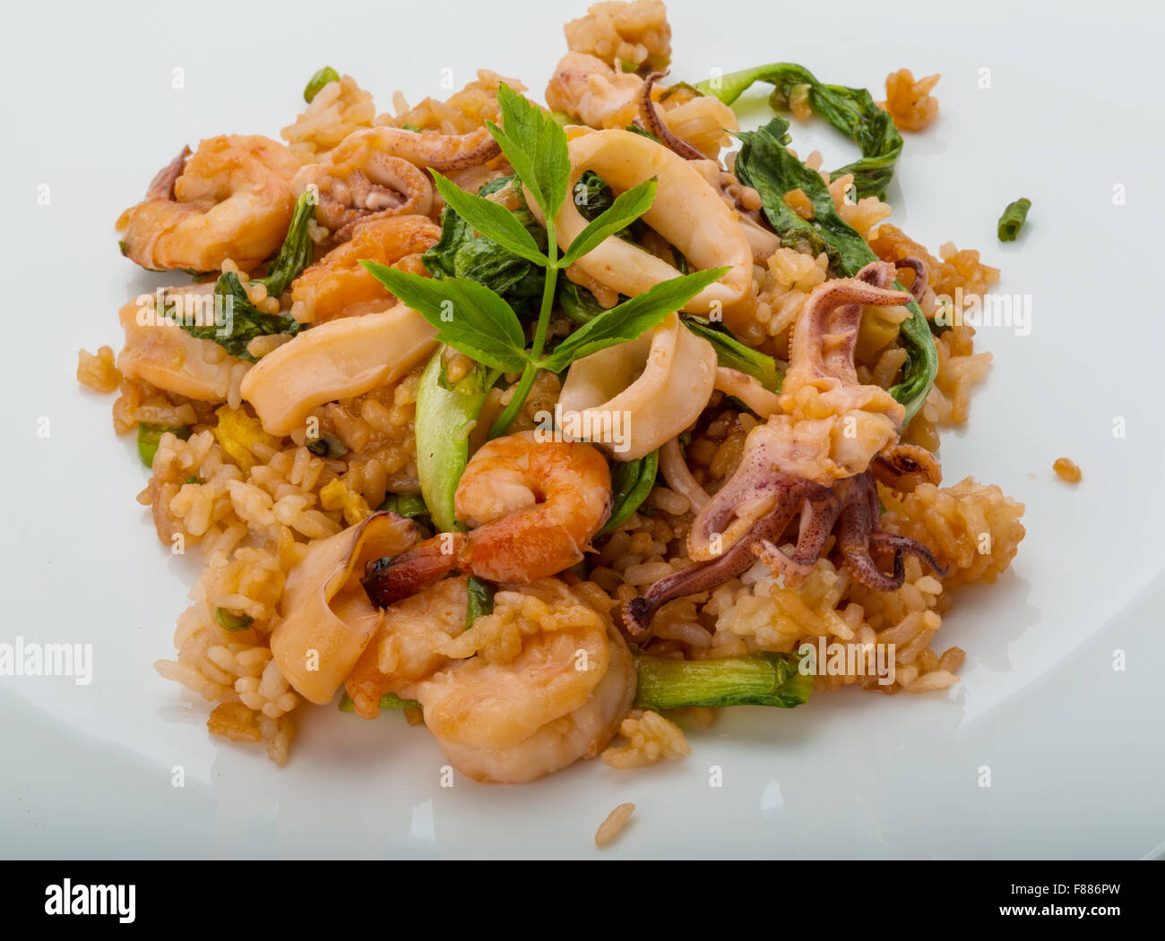 Rice with seafood isolated on white Stock Photo - Alamy