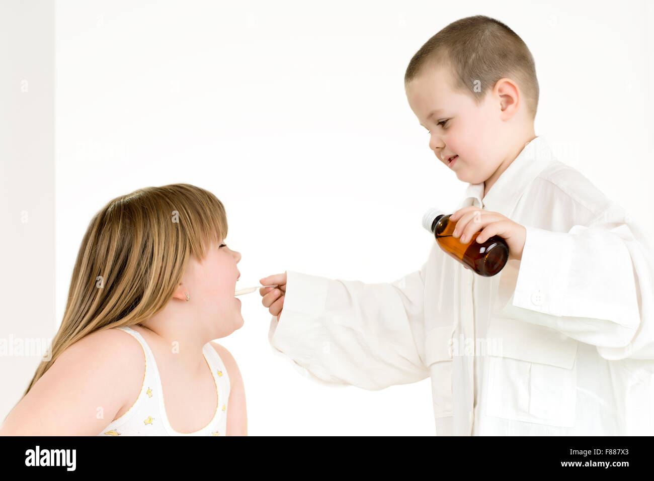 Boy Girl Playing Doctor High Resolution Stock Photography and Images ...