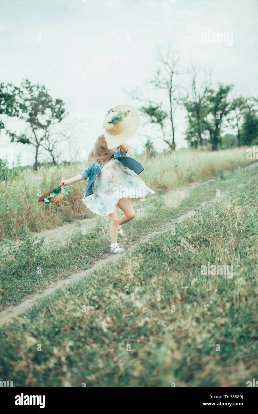The young girl on green grass background Stock Photo - Alamy