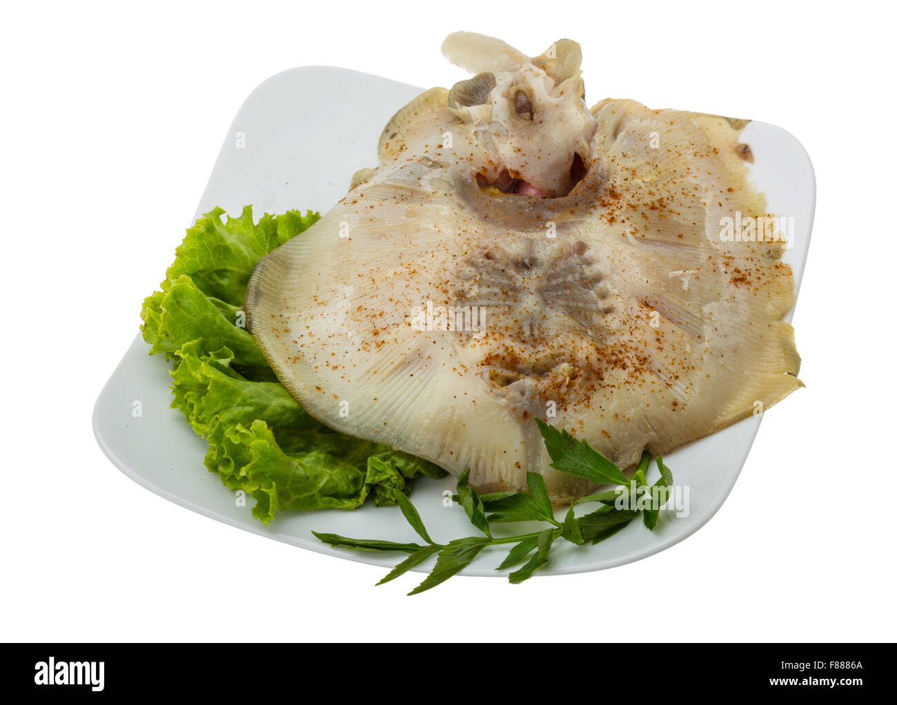 Grilled ray fish - Batoidea with salad Stock Photo - Alamy