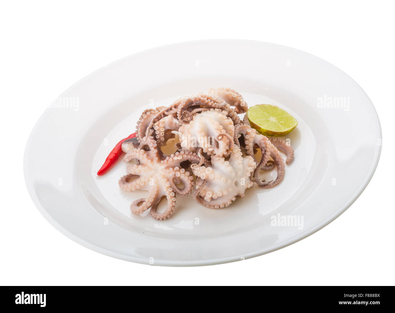 Boiled octopus with pepper and lime Stock Photo - Alamy