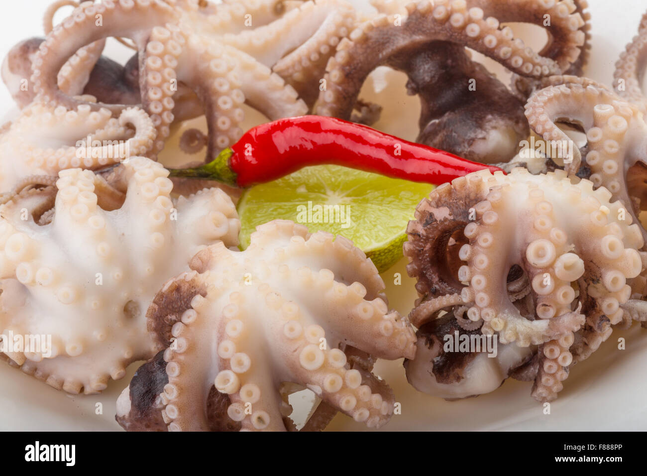 Boiled octopus with pepper and lime Stock Photo - Alamy