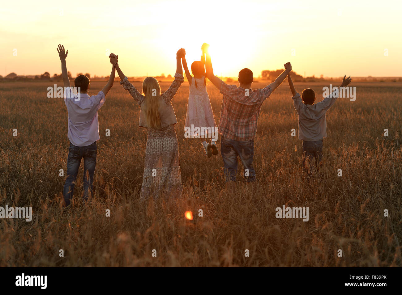 Family holding hands Stock Photo - Alamy