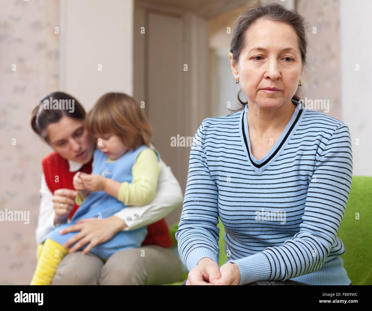 Conflict between generations. Sad mature grandmother against daughter ...