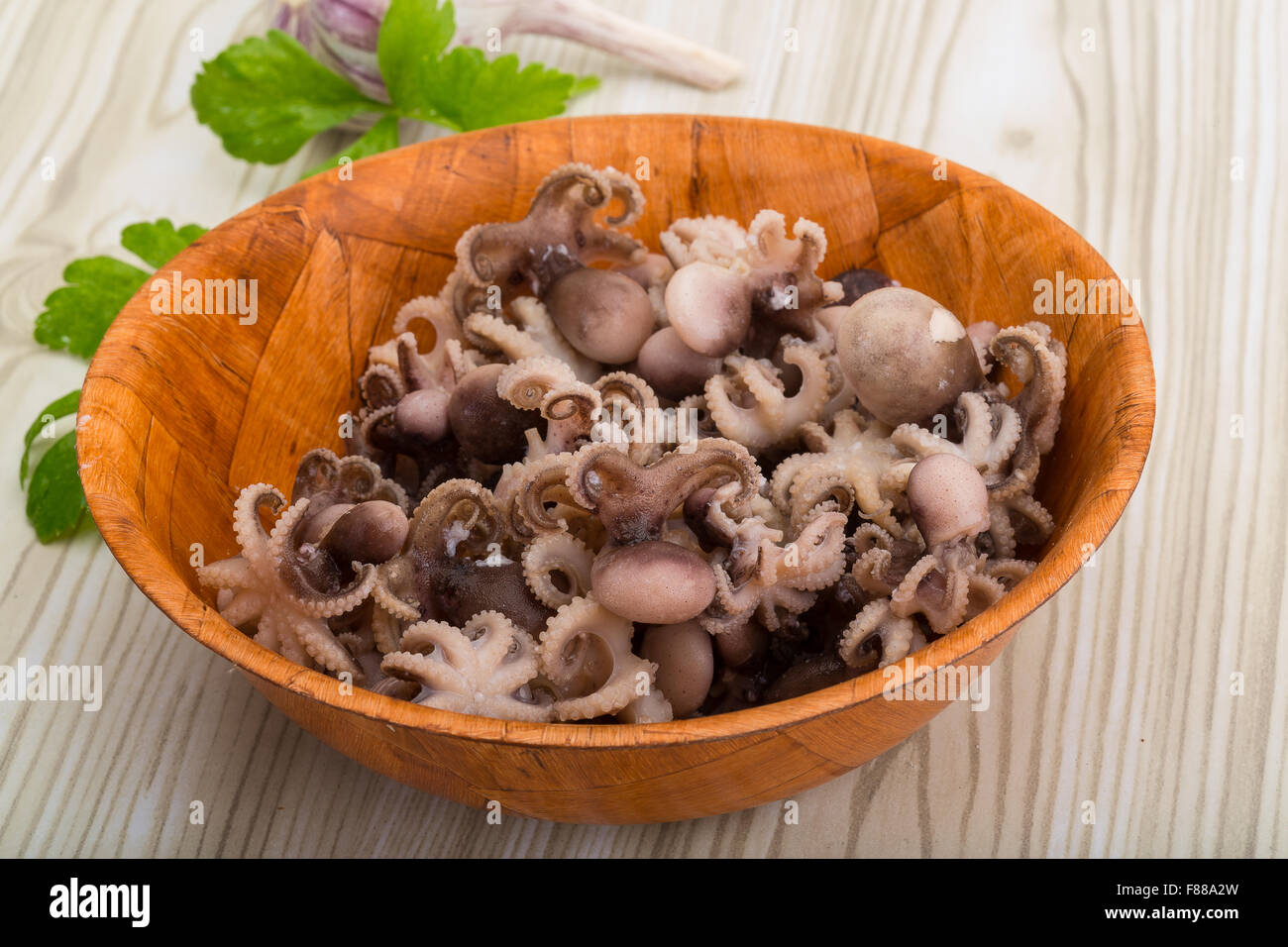 Boiled octopus - mini seafood in the bowl Stock Photo - Alamy