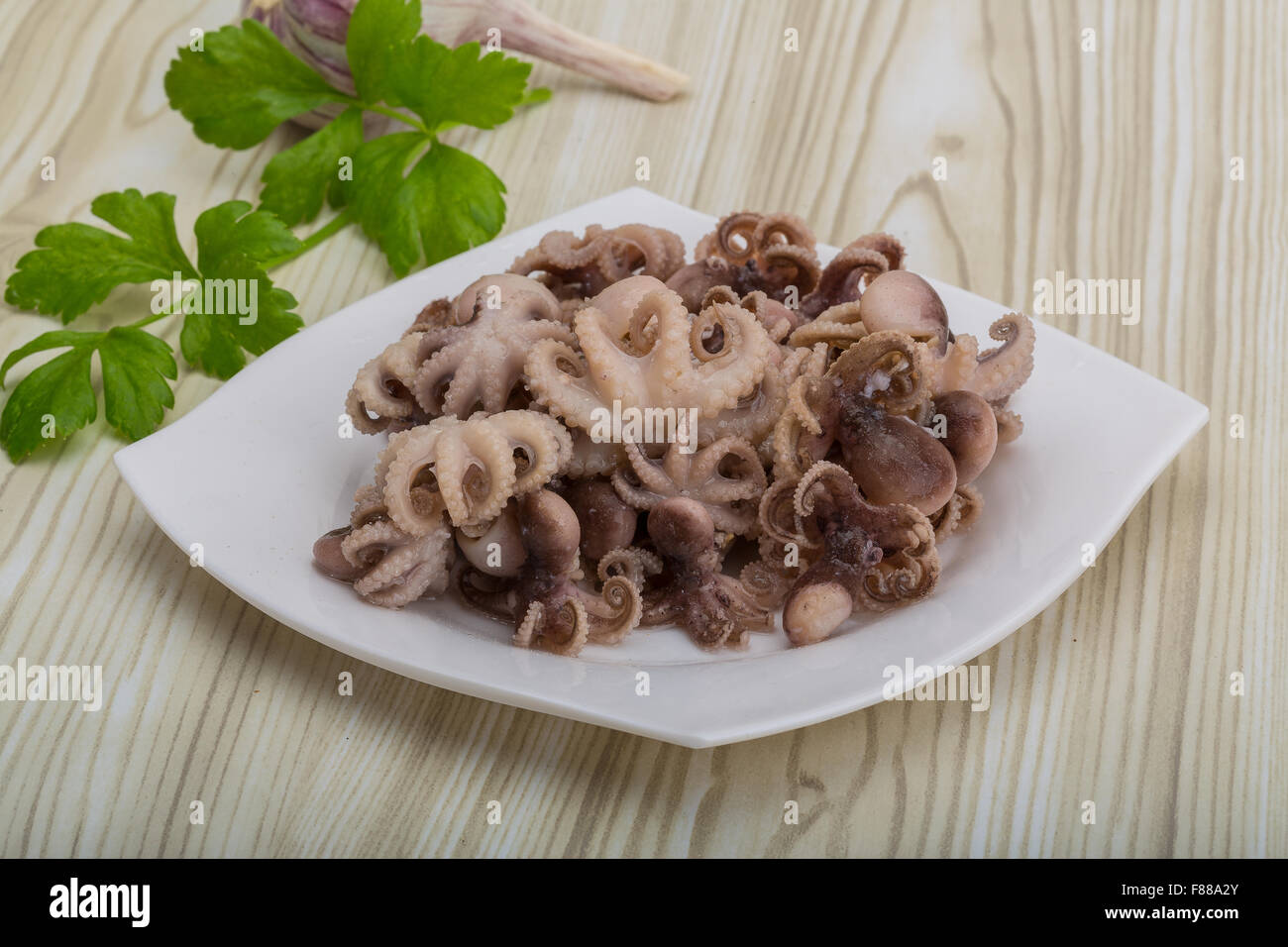 Boiled octopus - mini seafood in the bowl Stock Photo - Alamy