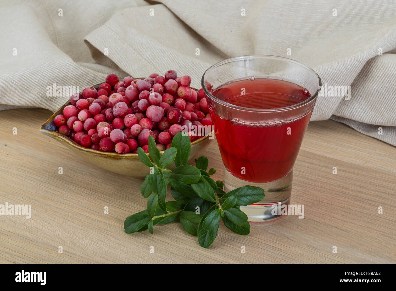 Fresh Cowberry juice with berries and branch Stock Photo - Alamy