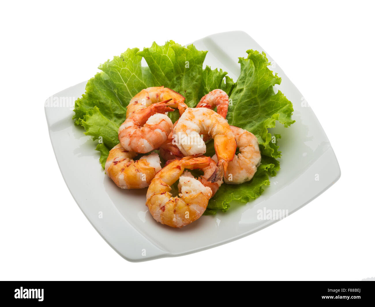 Unshelled king prawn heap with salad leaves Stock Photo - Alamy