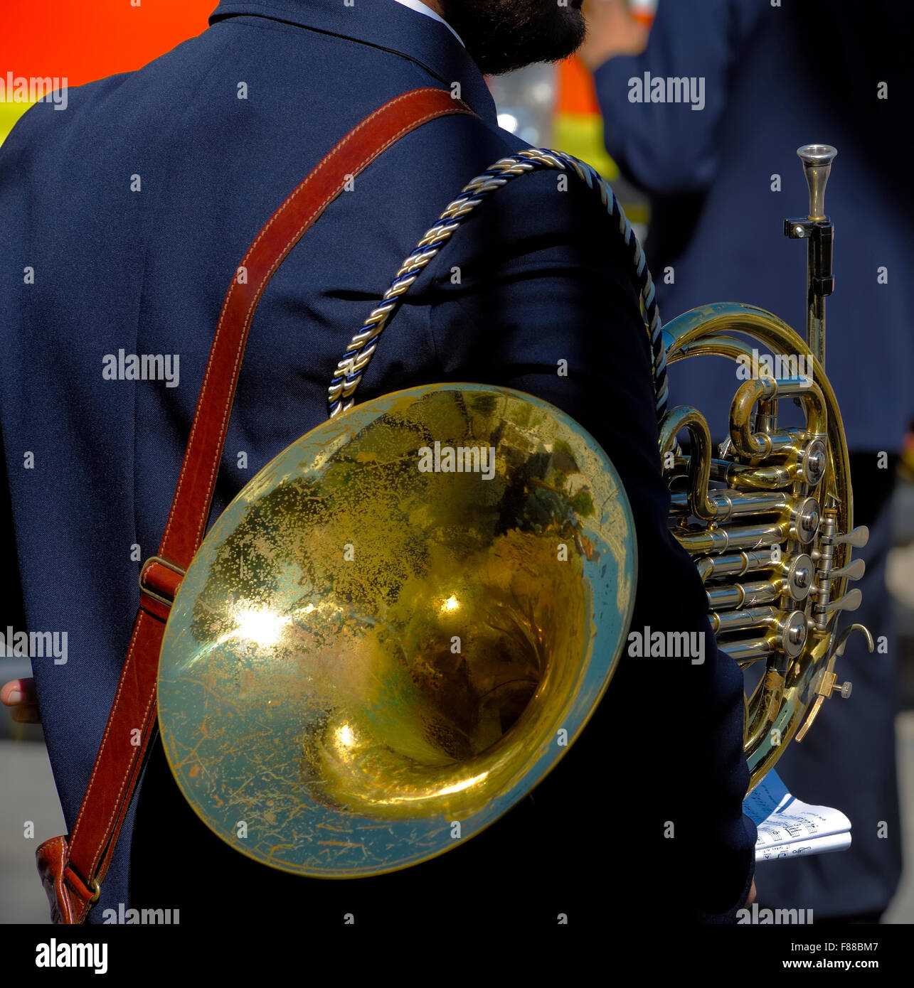 musician with his woodwind musical instrument (horn) during a break ...