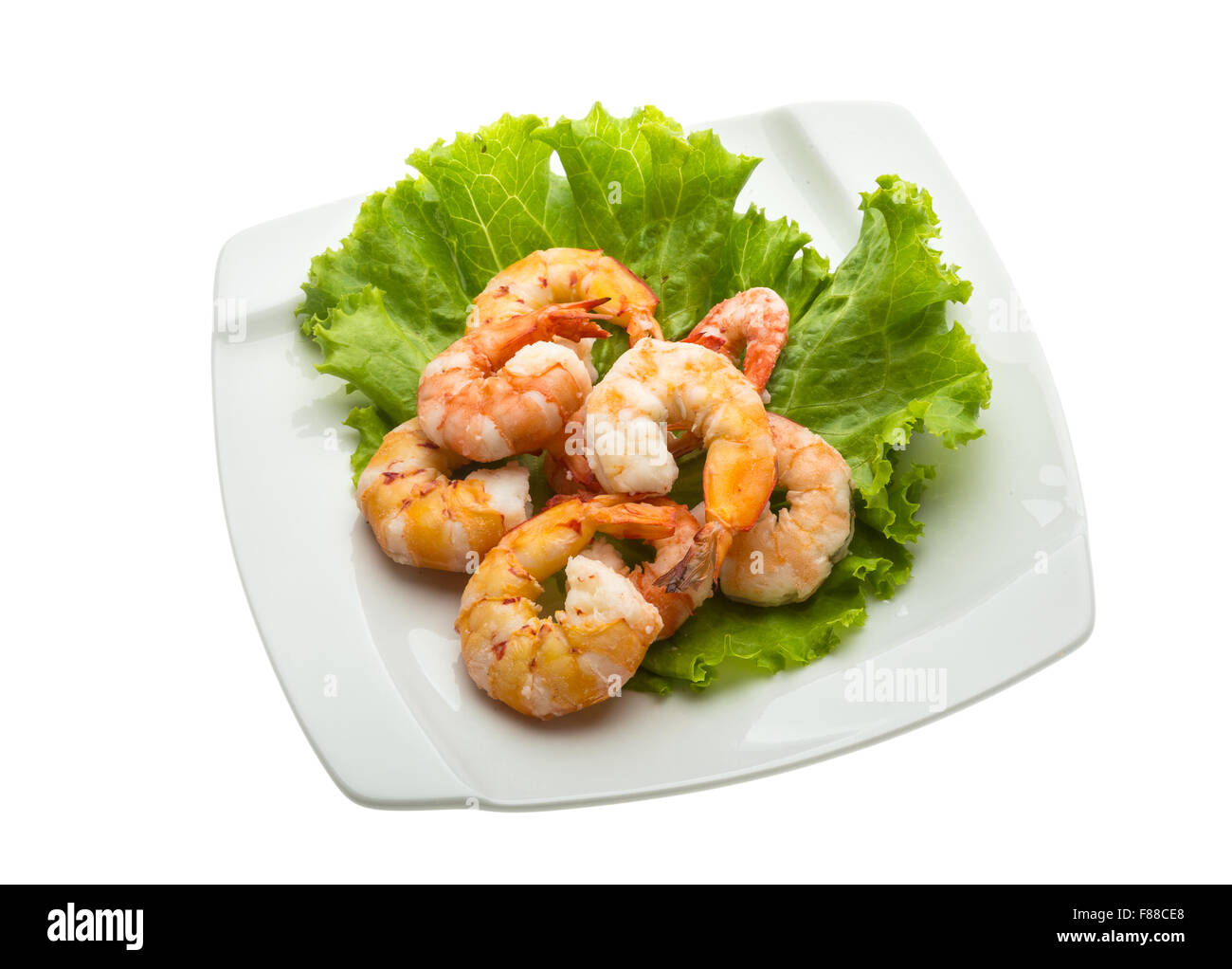 Unshelled king prawn heap with salad leaves Stock Photo - Alamy