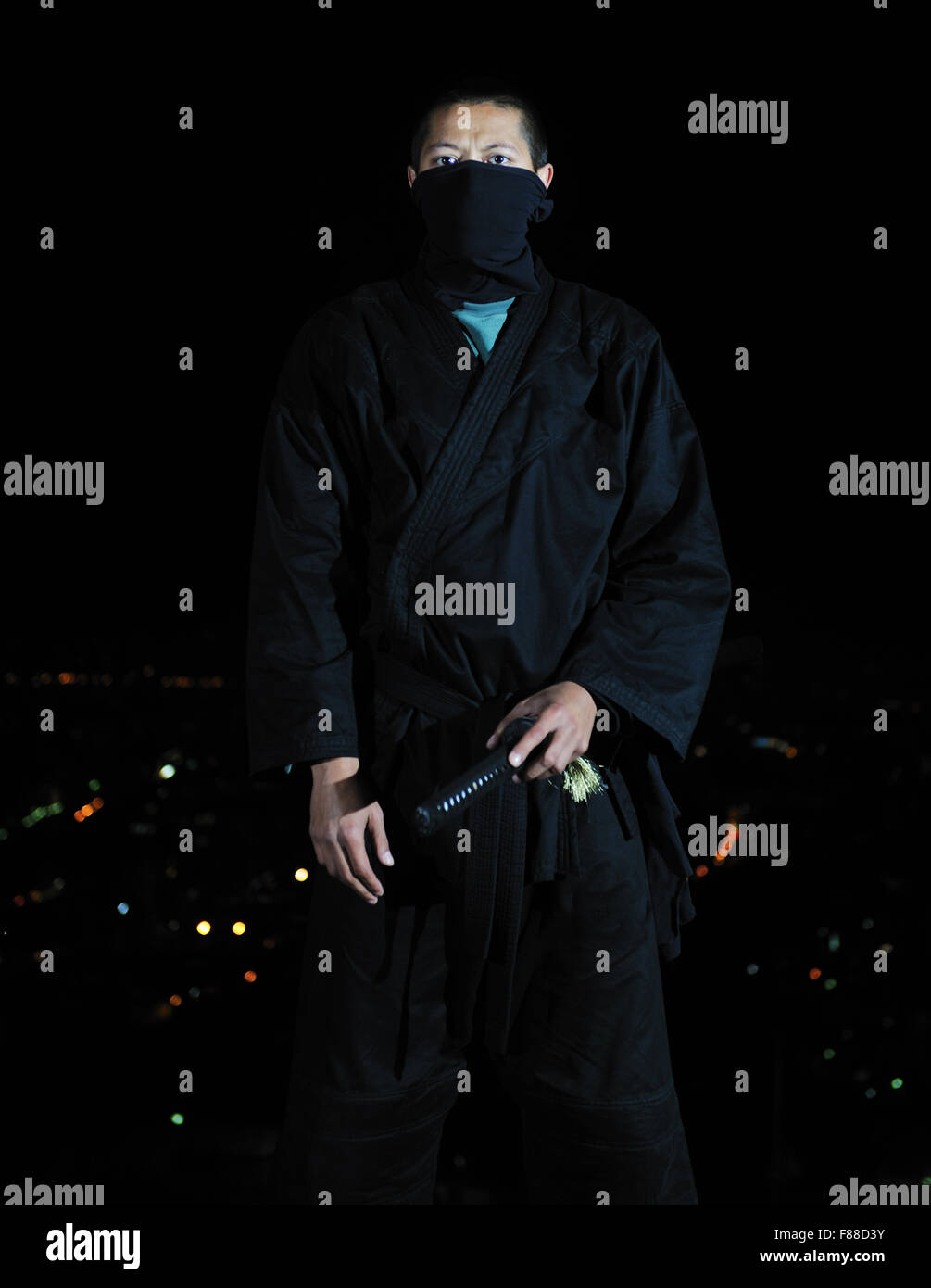 ninja assasin hold katana samurai old martial weapon swordat night with ...